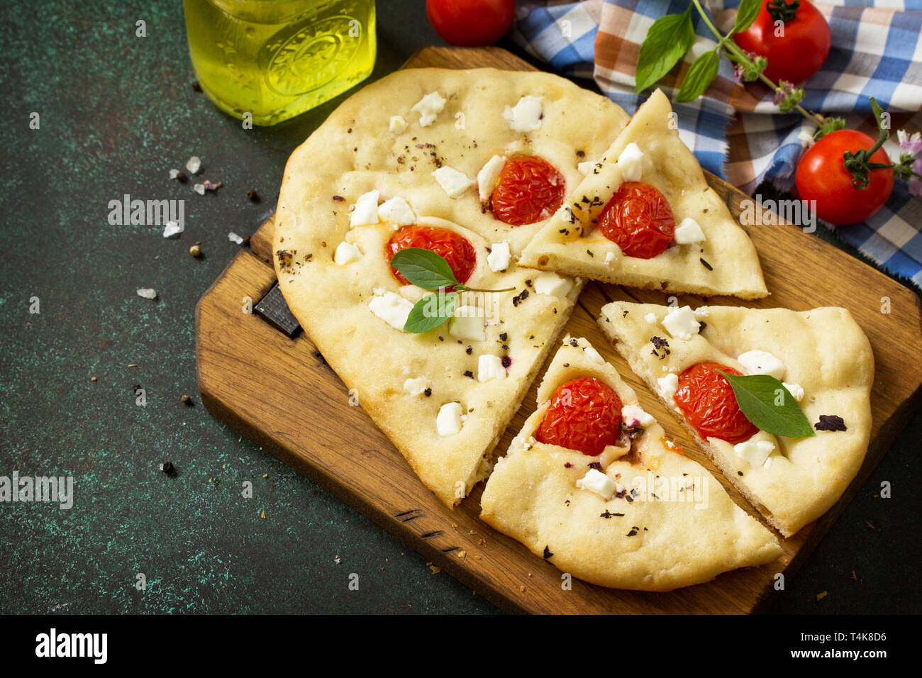 Traditional Italian Focaccia with rosemary, tomatoes and feta ...