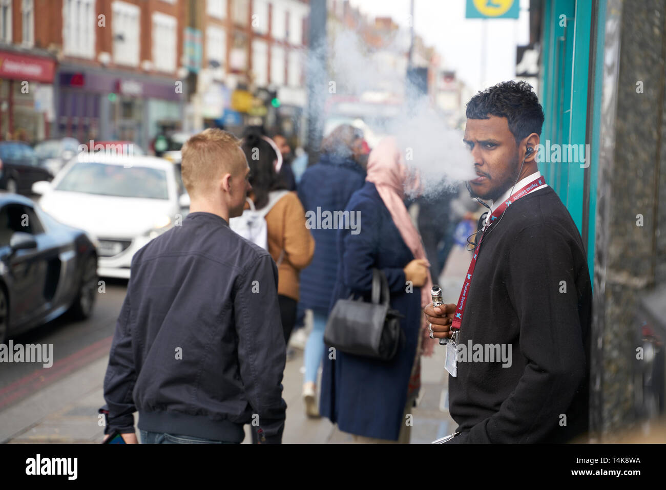 Man vaping on the street Stock Photo - Alamy