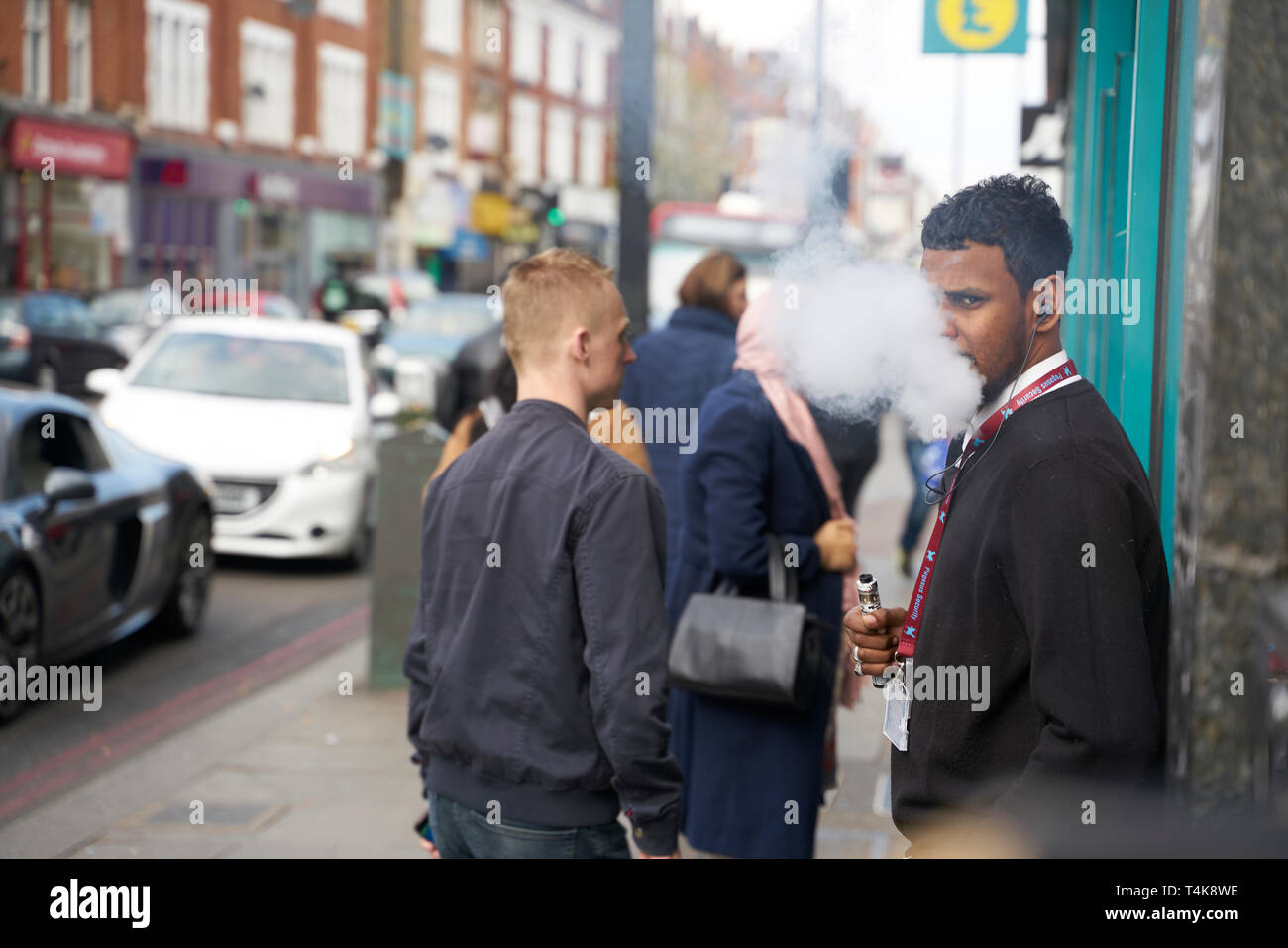 Man vaping on the street Stock Photo - Alamy
