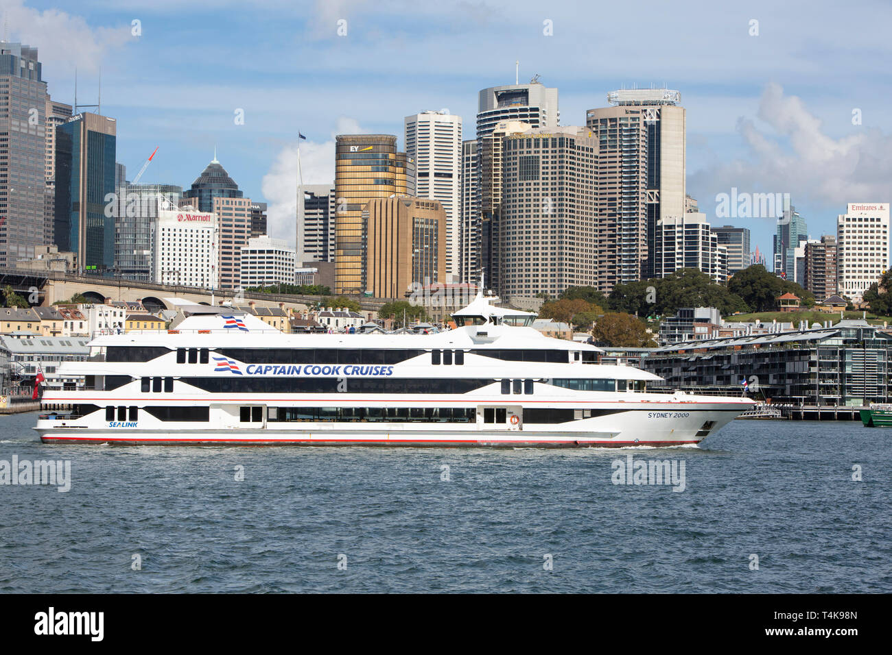 Captain Cook Cruises boat on Sydney harbour with Sydney city in the ...