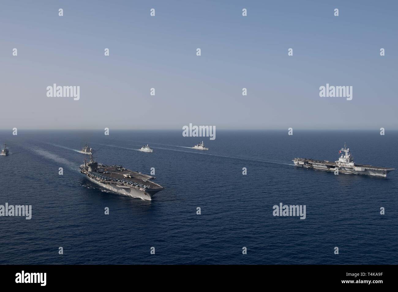 The aircraft carrier USS John C. Stennis (CVN 74), front left, the ...