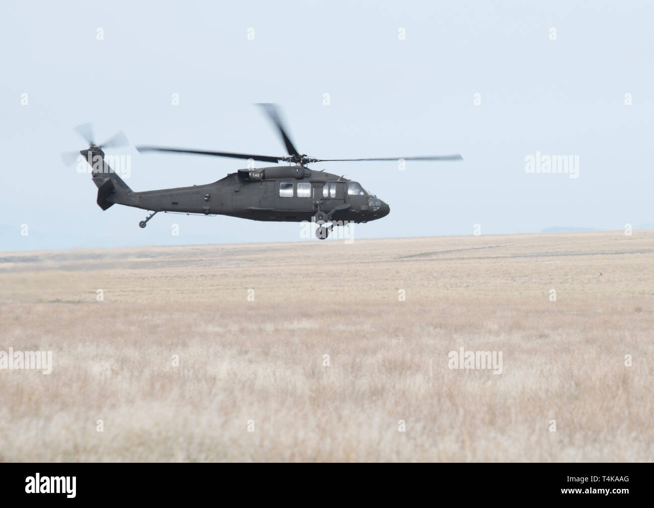 An Idaho National Guard UH-60 Blackhawk helicopter flies over the ...