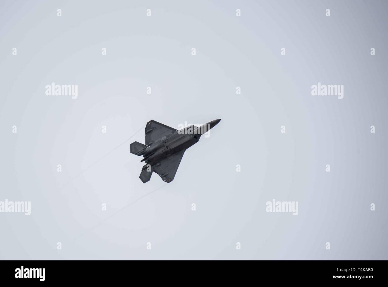 An F-22 Raptor soars through the sky April 11, 2019, over McConnell Air ...