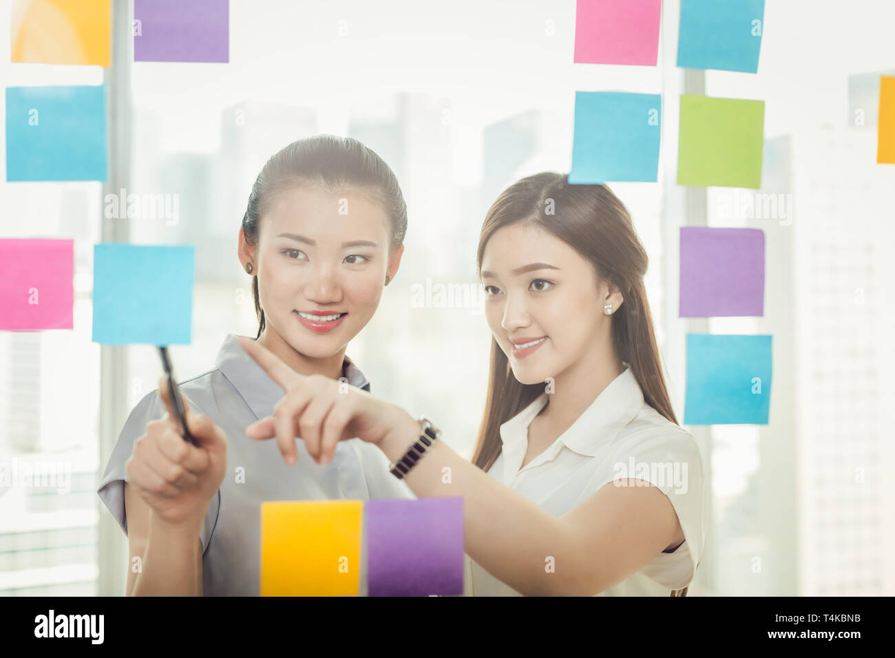 Businesswomen making business plan Stock Photo - Alamy