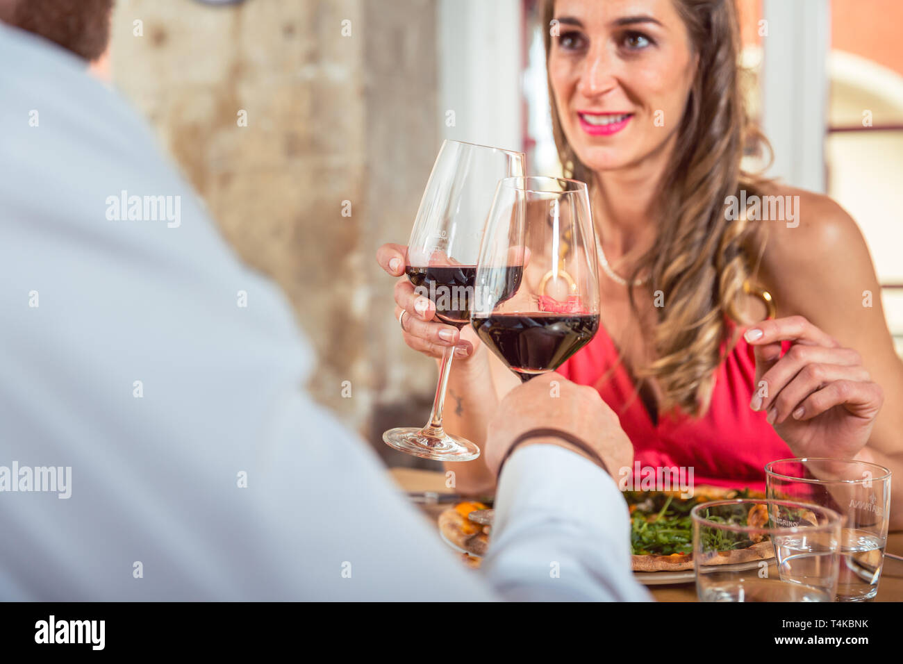 Young man toasting wine hi-res stock photography and images - Alamy