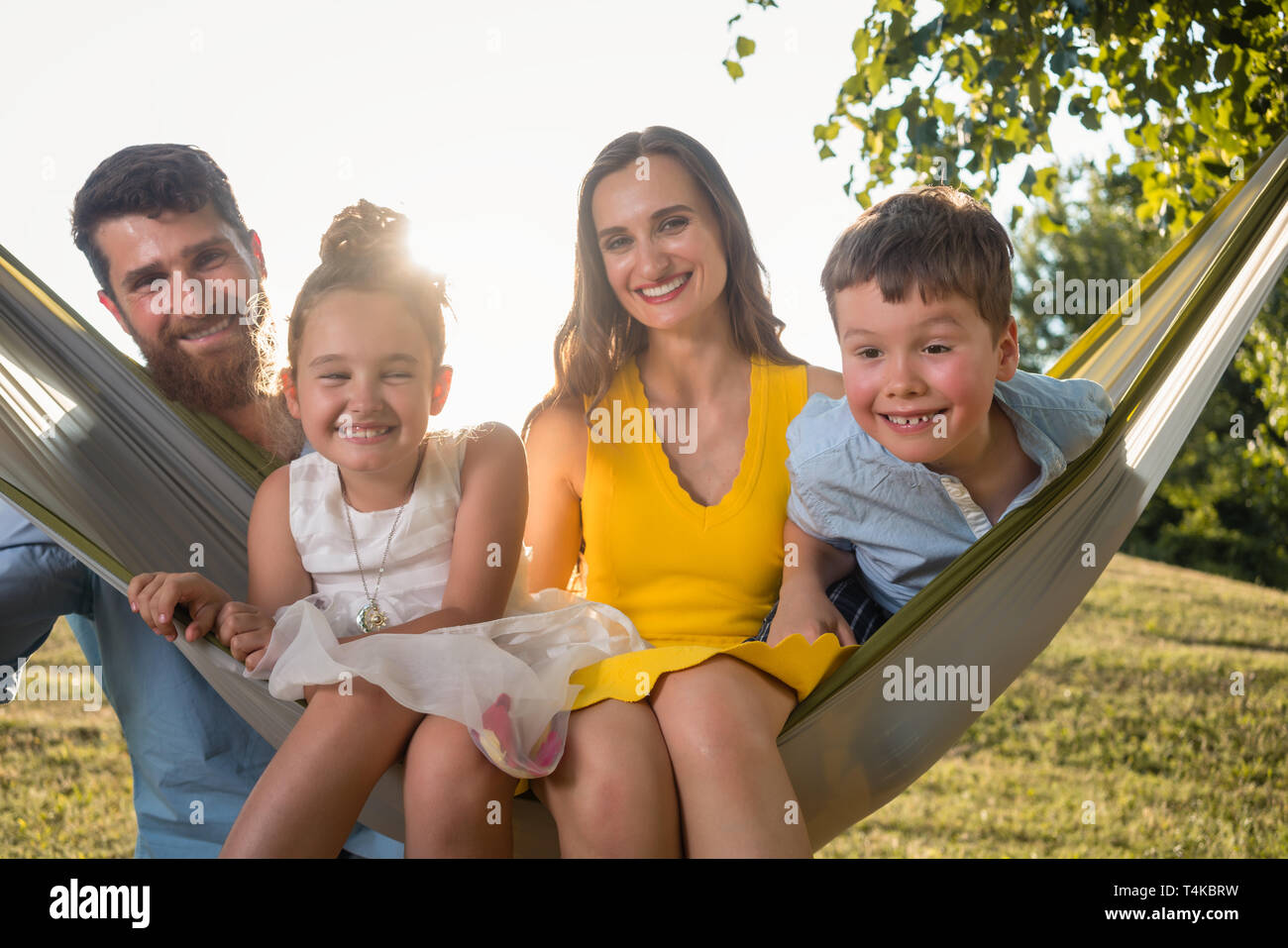 Cute child making funny face while looking at camera for a family ...
