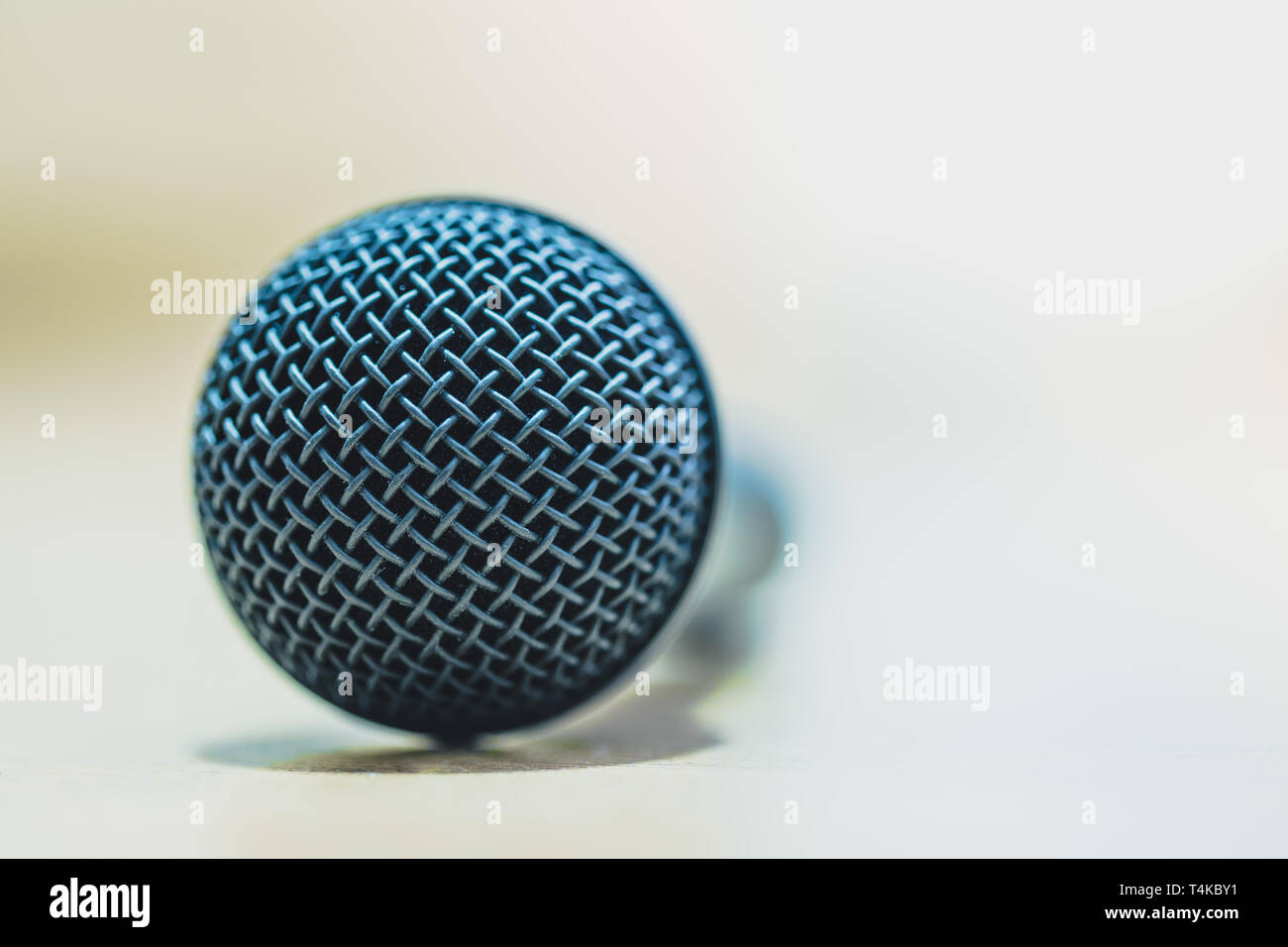 Black microphone stands on the desk. Interview, copy space Stock Photo ...