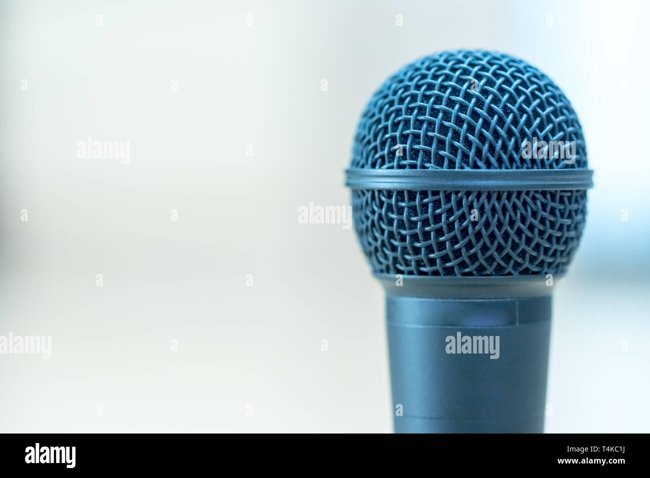 Black microphone stands on the desk. Interview, copy space Stock Photo ...