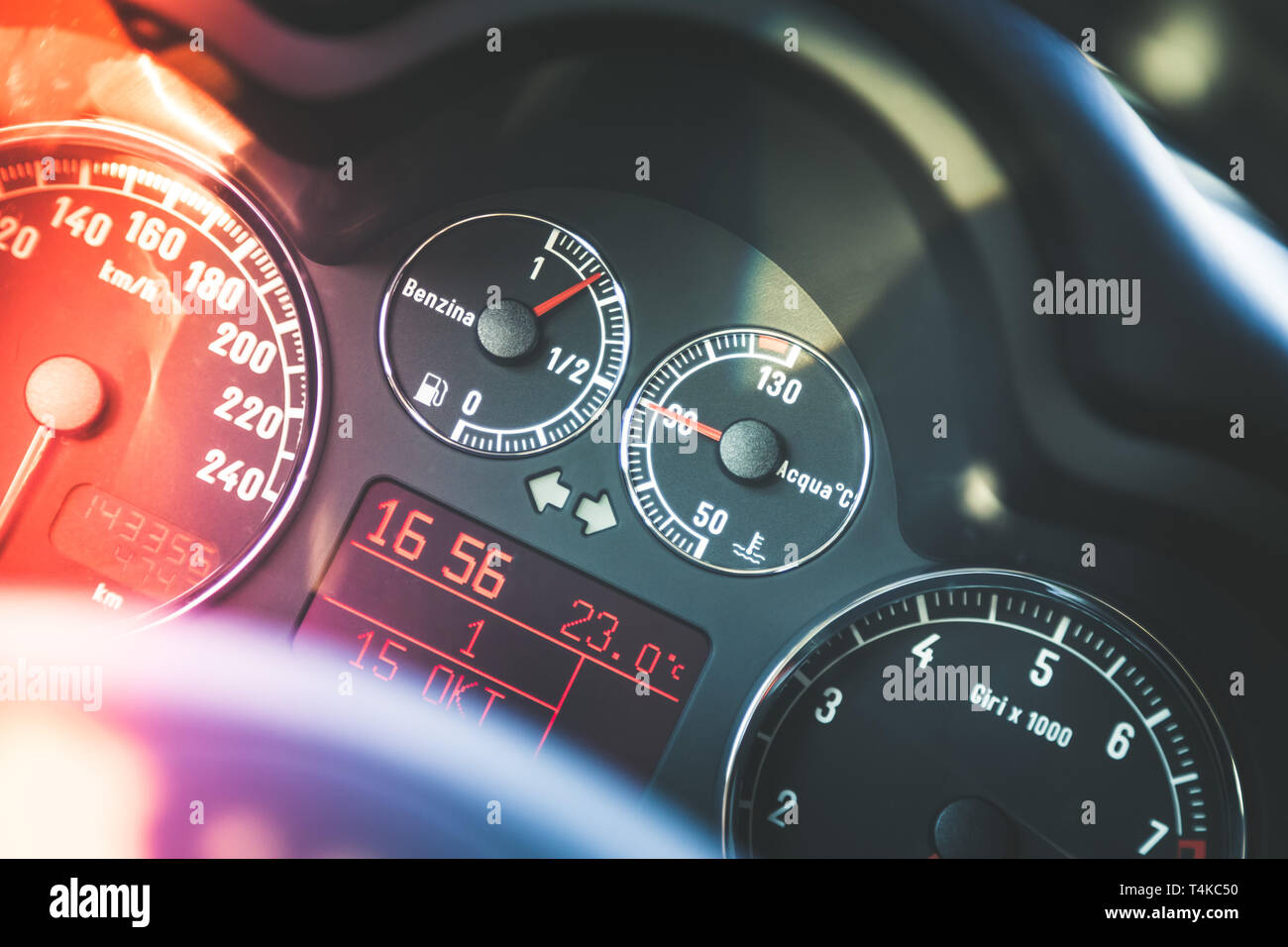 Closeup of the dashboard of a sports car, tachometer and fuel indicator ...
