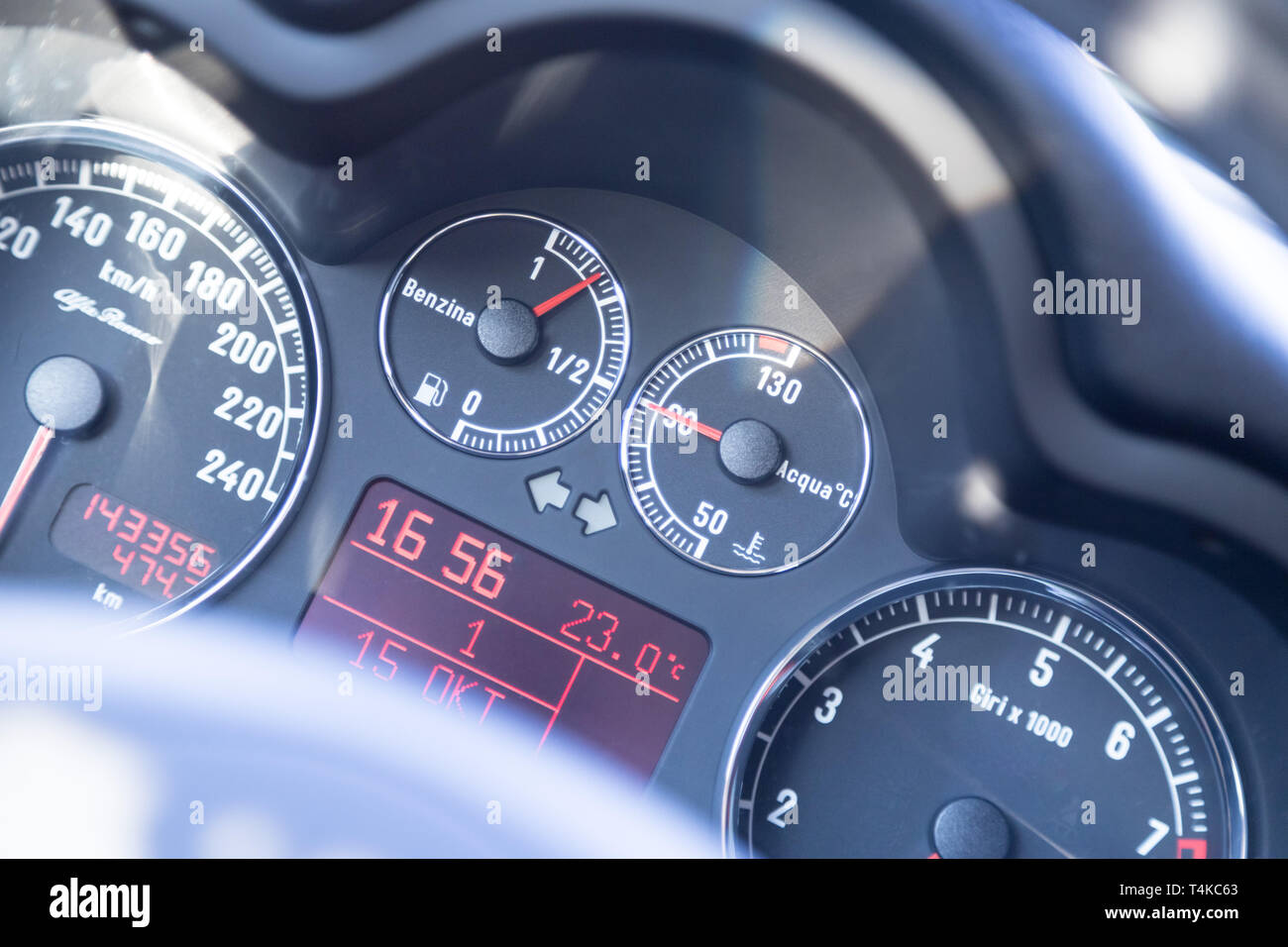 Closeup of the dashboard of a sports car, tachometer and fuel indicator ...