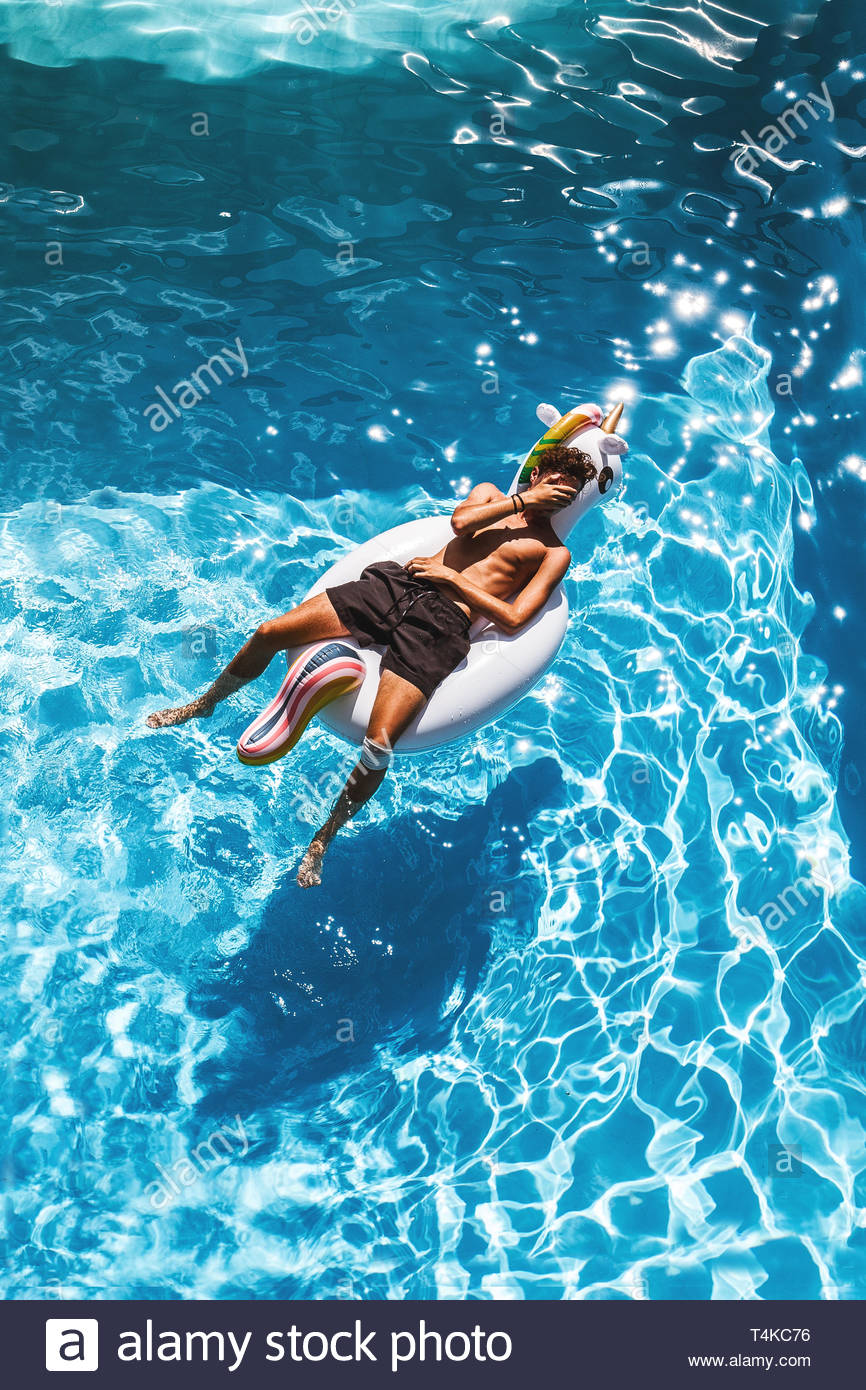Person Laying By The Pool Stock Photos & Person Laying By The Pool ...