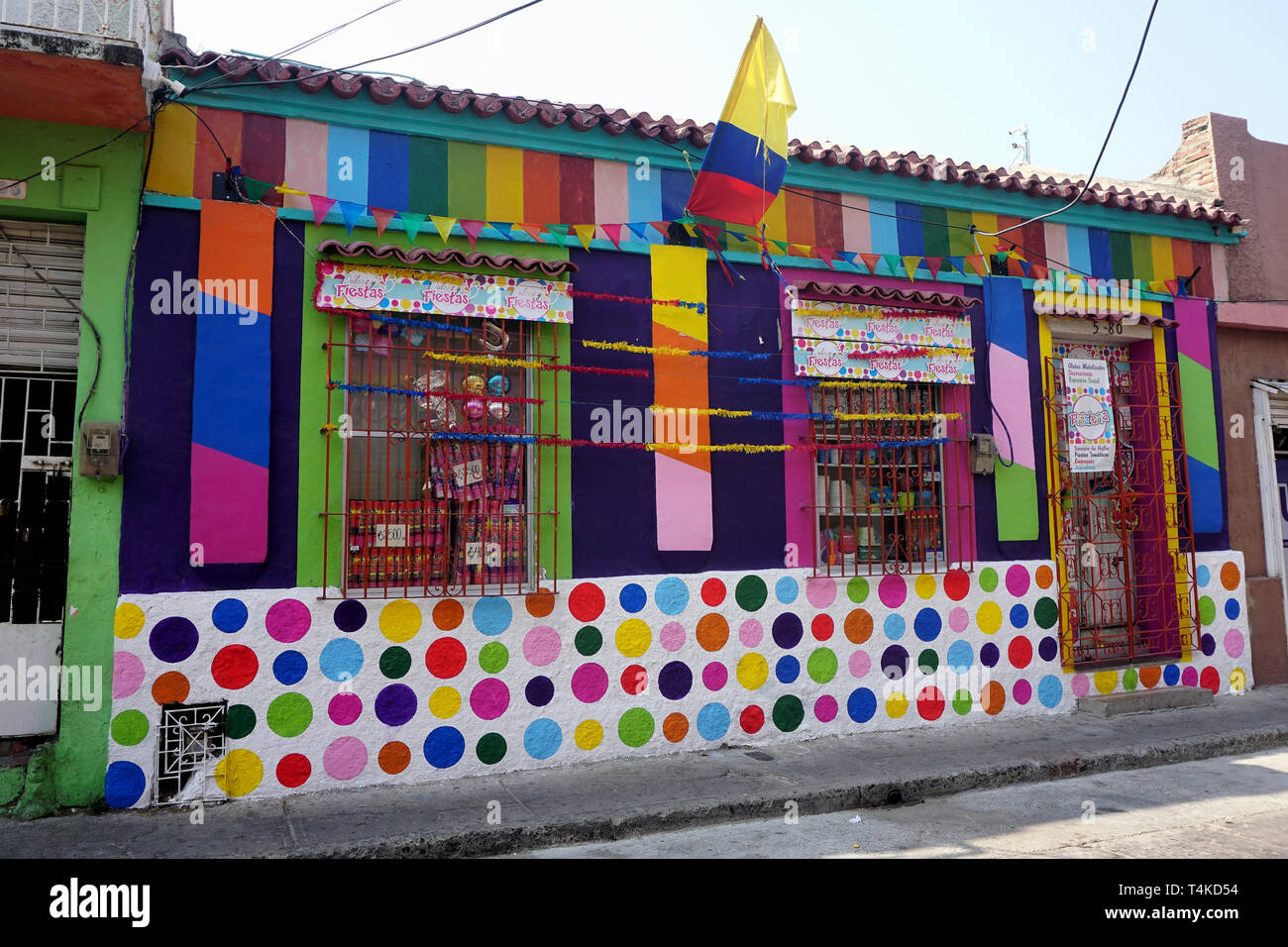 Rainbow-Colored Exterior of a Partyware Store Stock Photo - Alamy