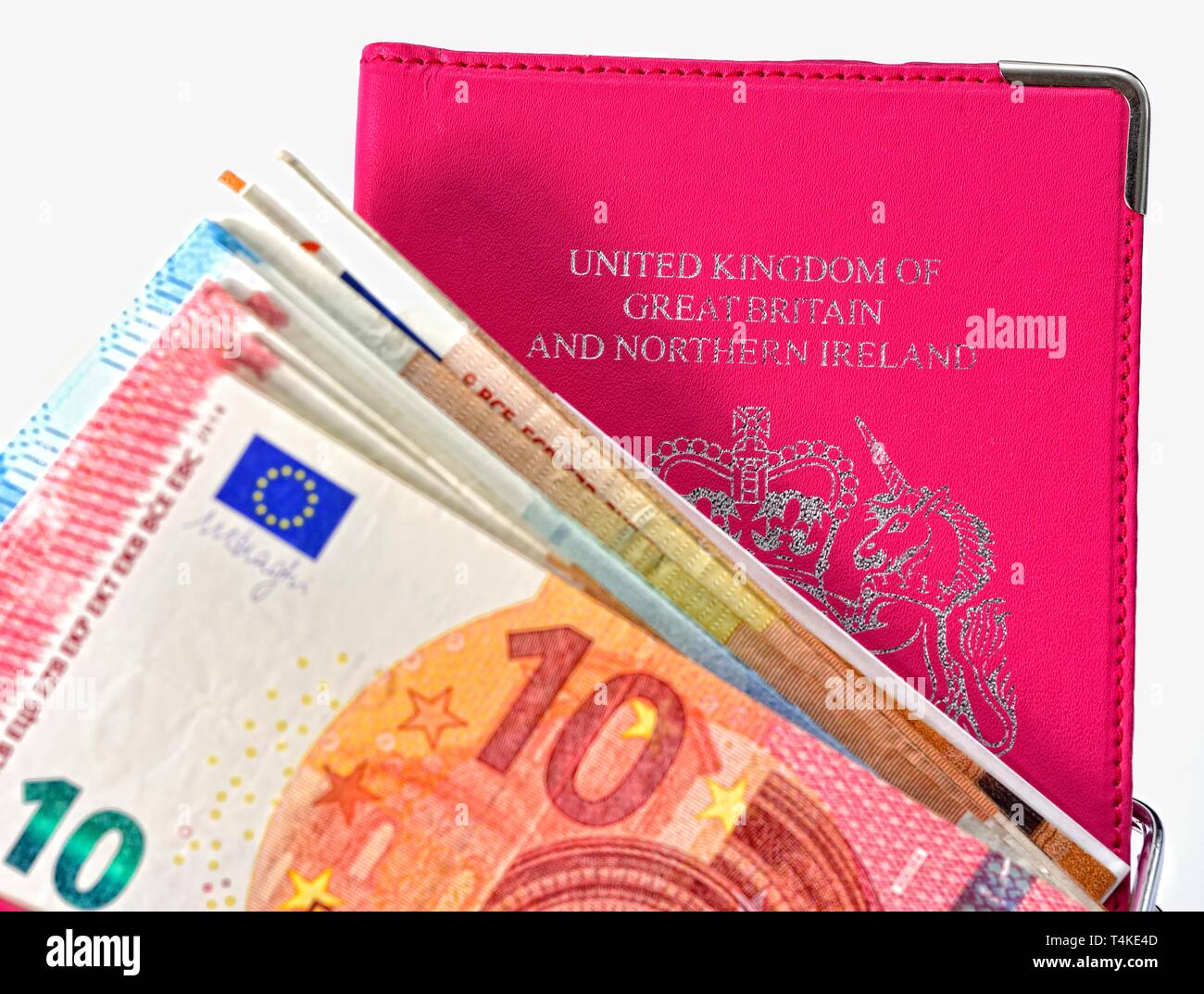 Euro bank notes a Pink British passport cover Stock Photo - Alamy