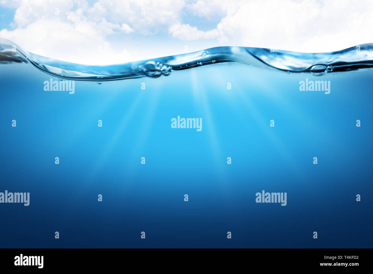 Underwater sea with sun rays. Waves of the ocean and sky with clouds ...