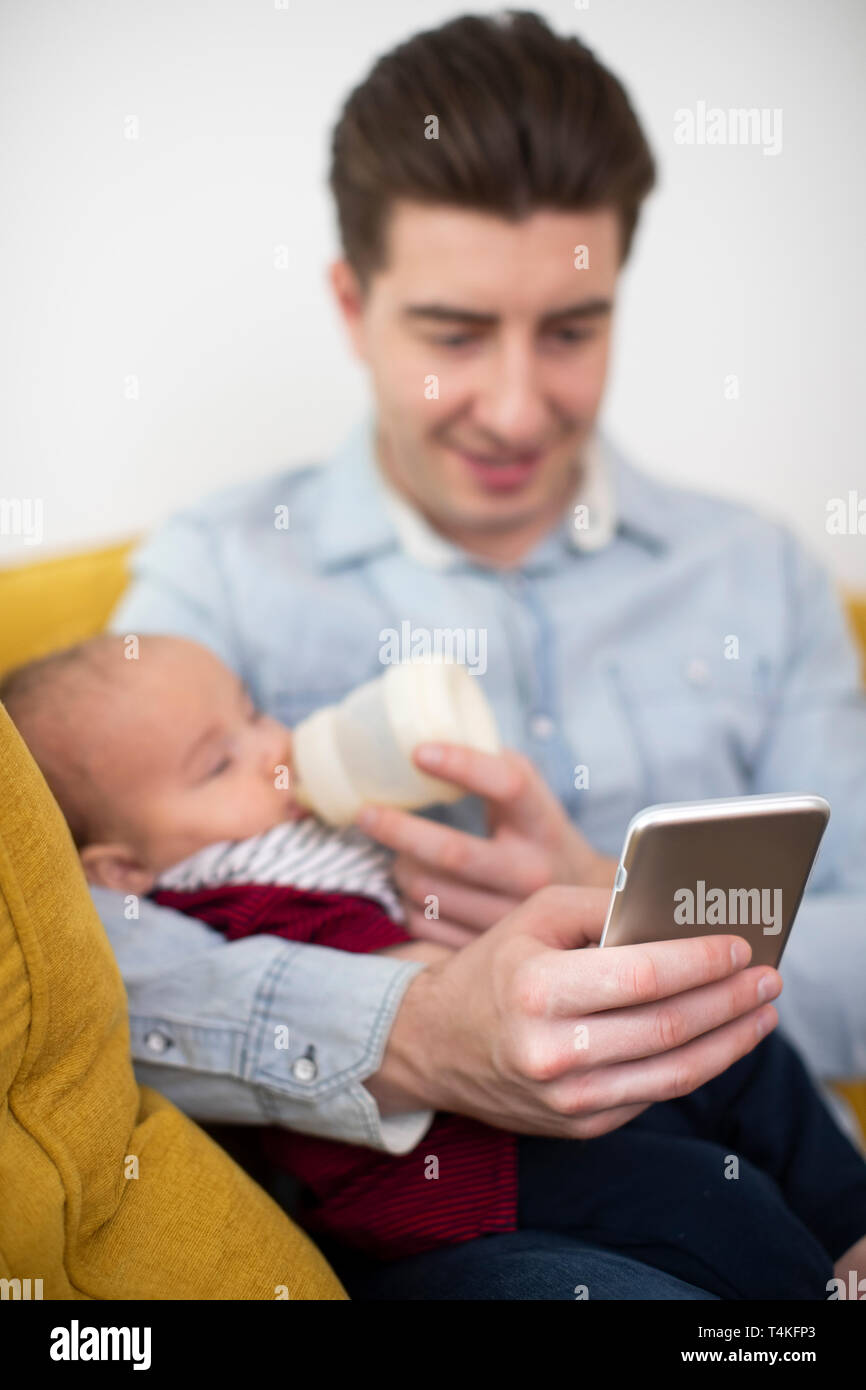 Boy feeding father hi-res stock photography and images - Alamy