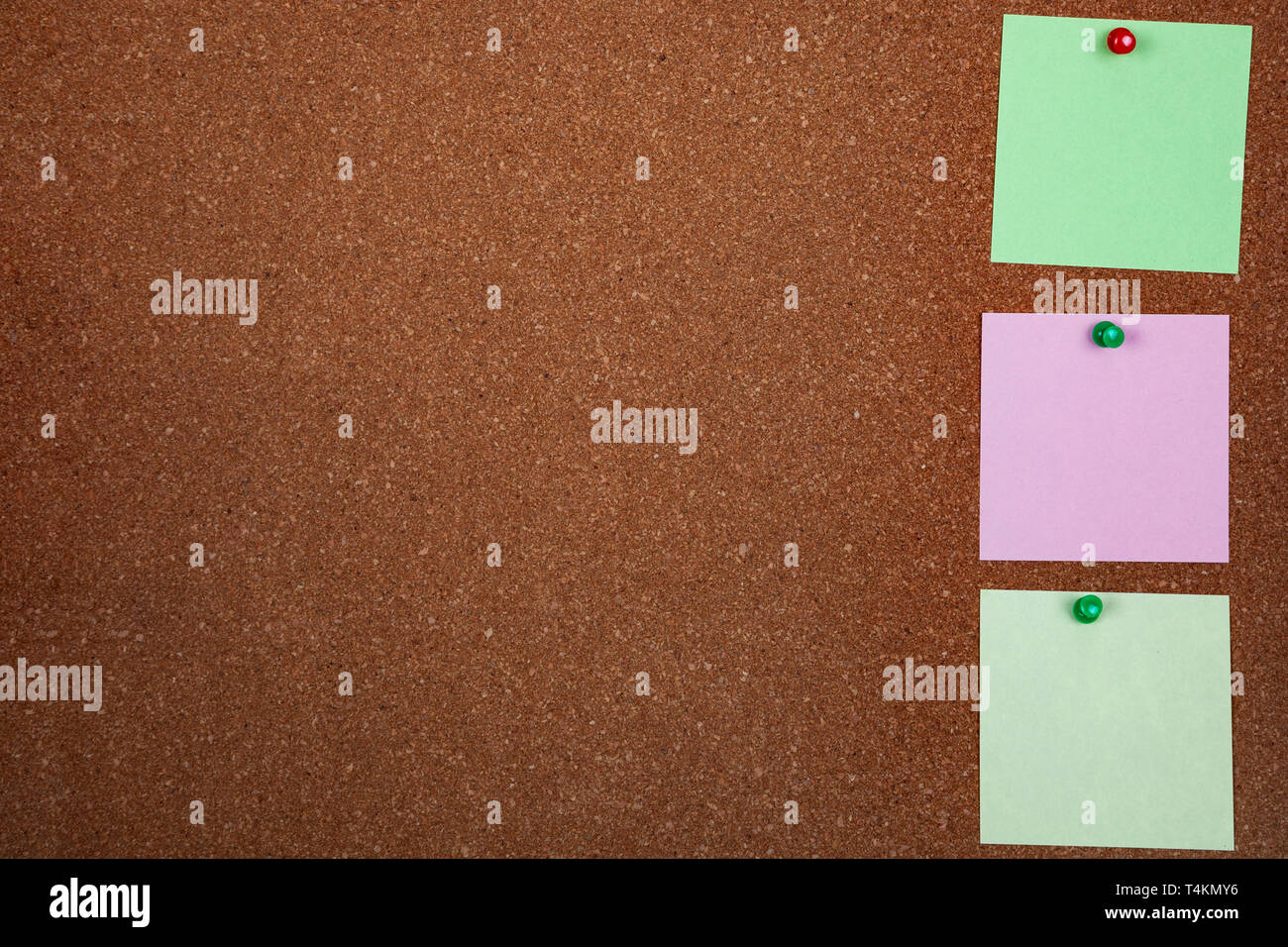 Three sheets of paper on corkboard. Place for your text Stock Photo - Alamy