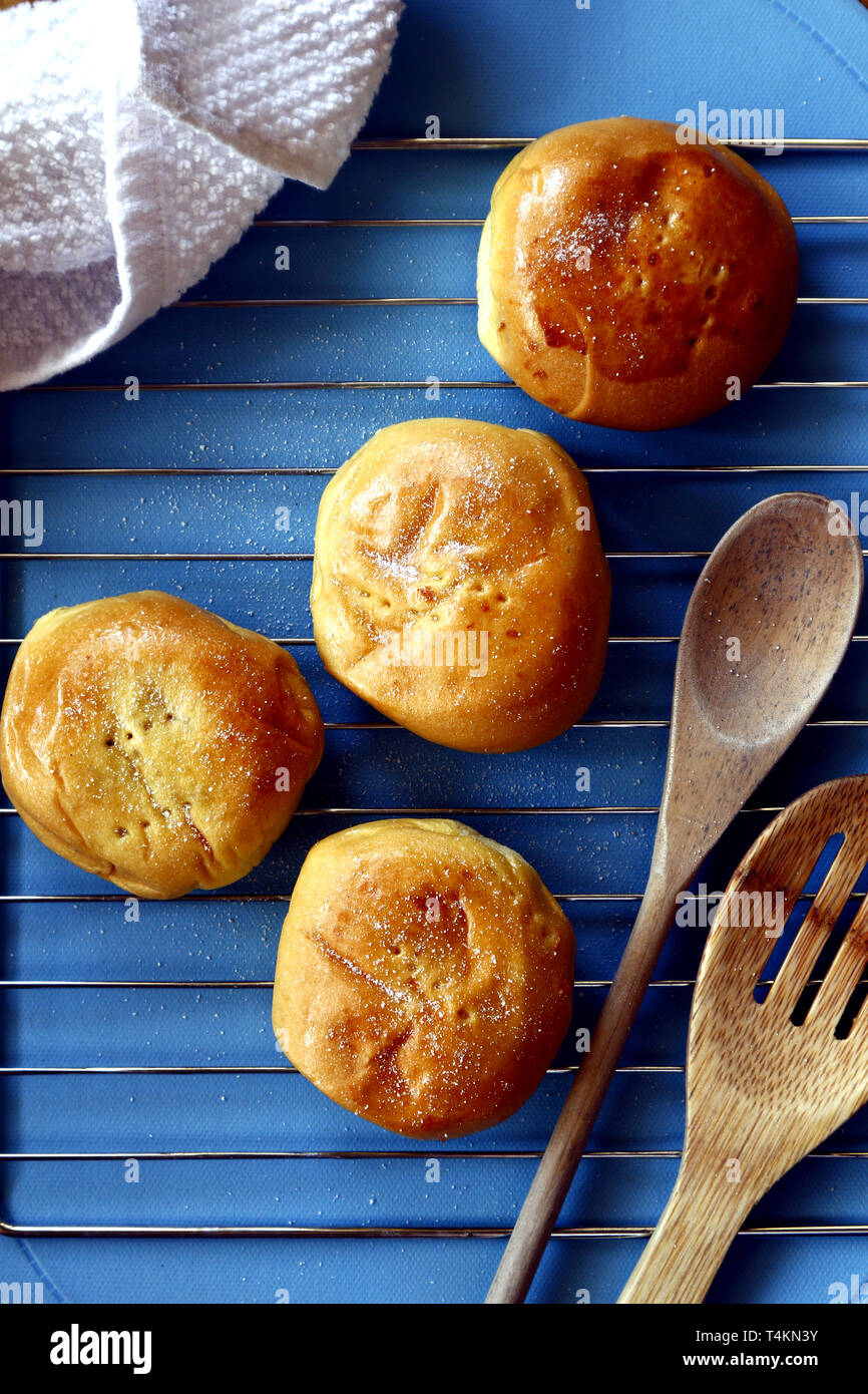 Photo of freshly baked Filipino delicacy called Pan de Coco or bread ...
