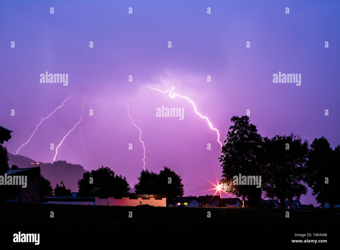 Lightning on the colored sky, night Stock Photo - Alamy