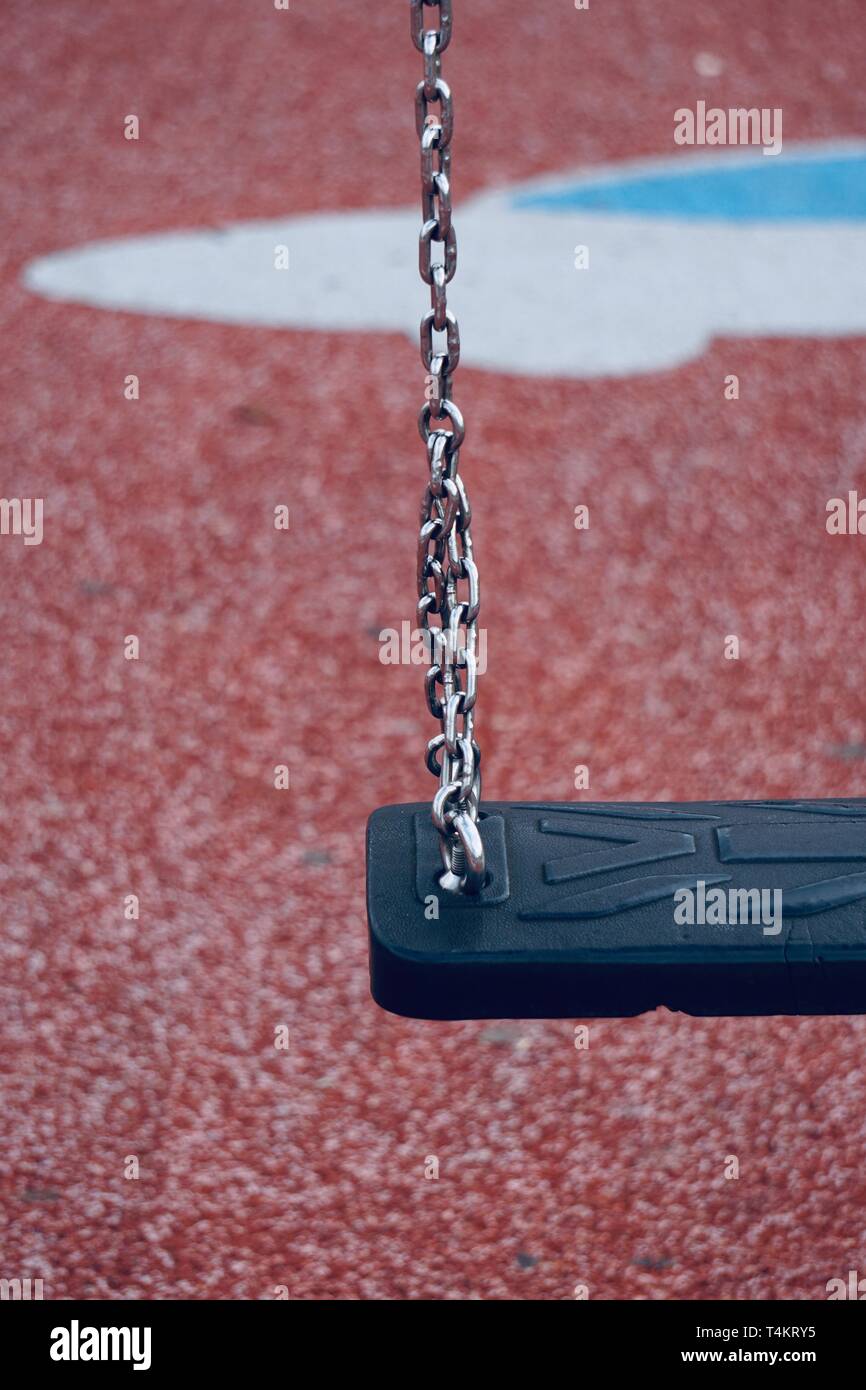 old swing in the playground on the street Stock Photo - Alamy