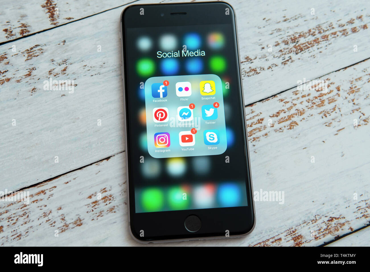 Black Apple iPhone with icons of social media: instagram, youtube ...