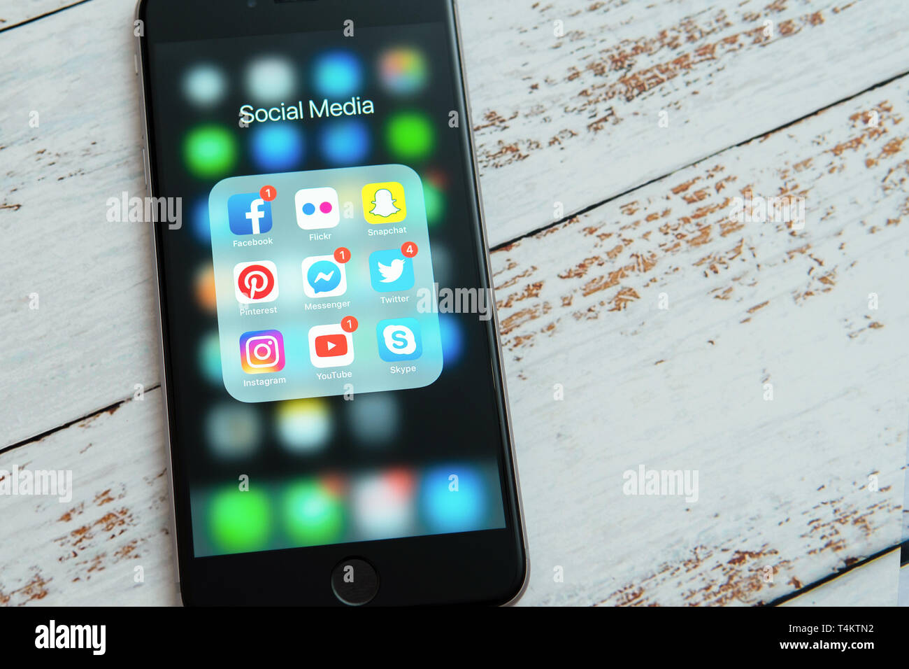 Black Apple iPhone with icons of social media: instagram, youtube ...