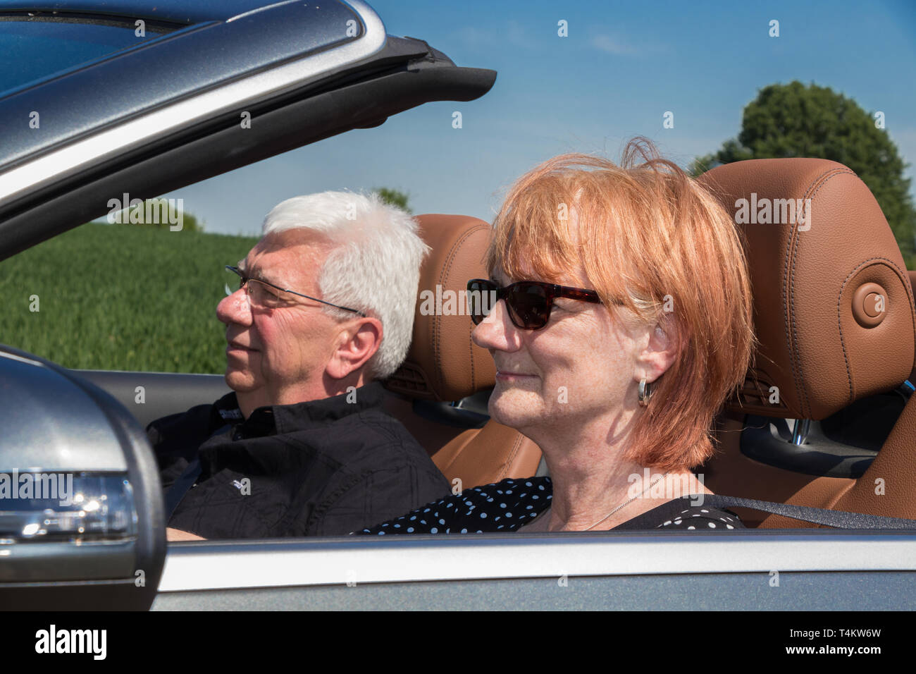 Senior woman with partner driving a car Stock Photo - Alamy