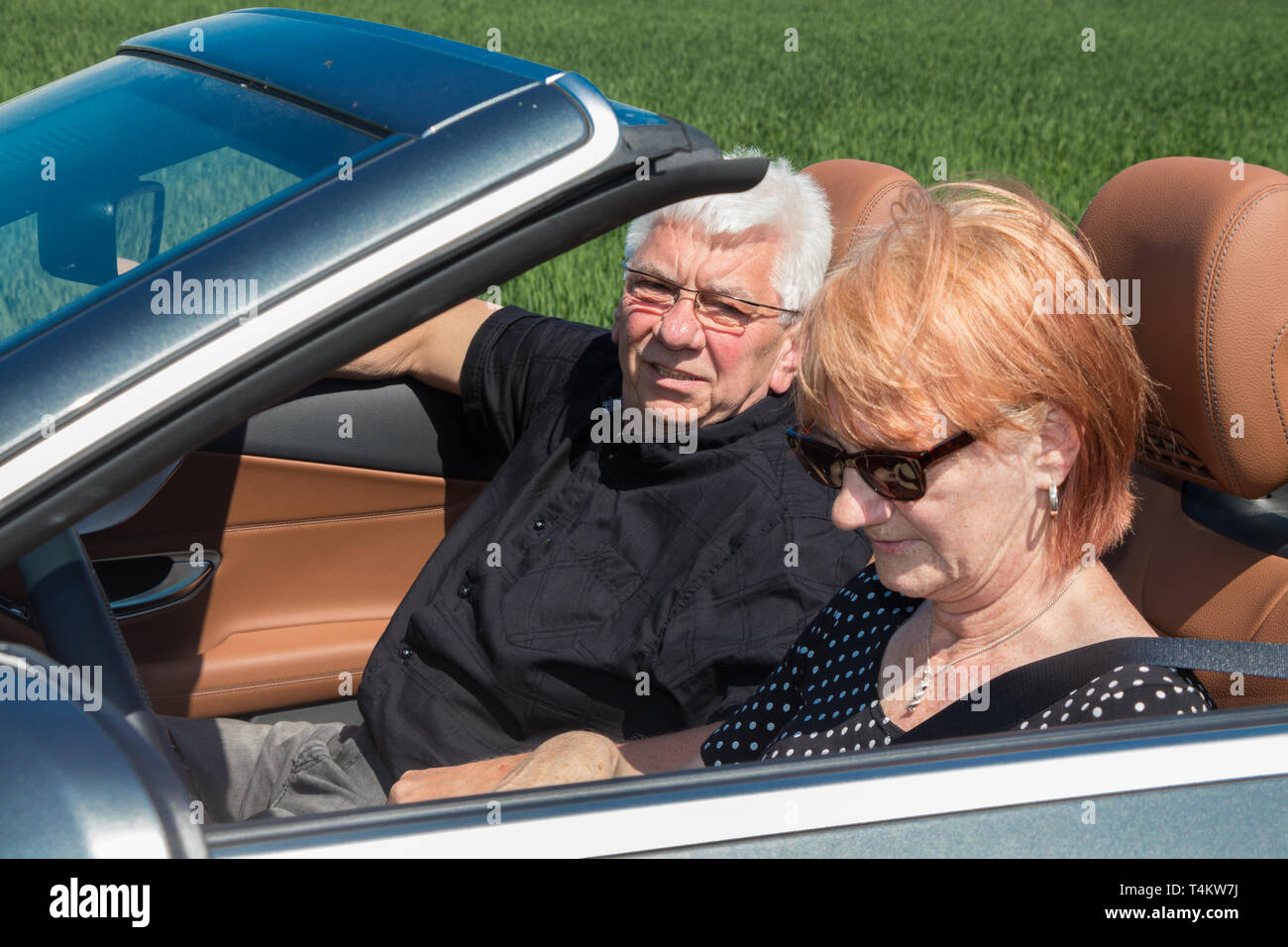 Happy elderly couple sports car hi-res stock photography and images - Alamy