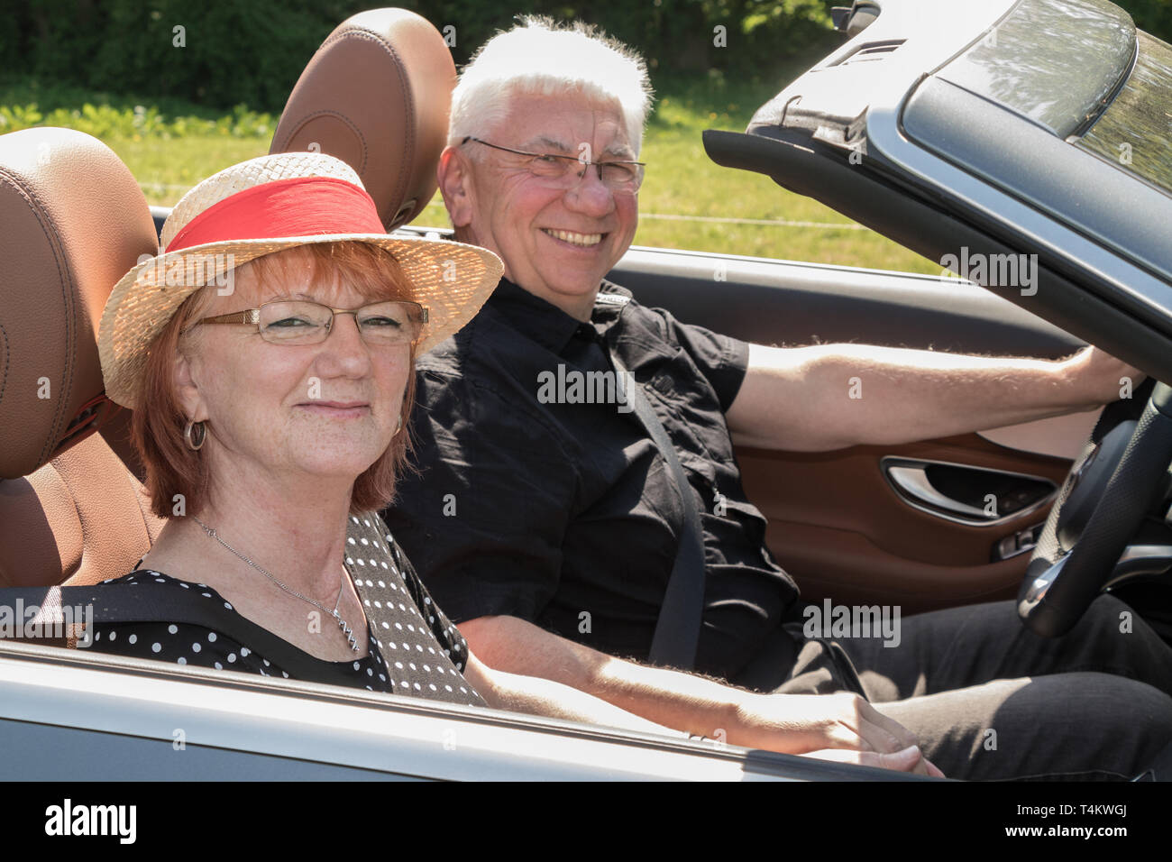 Happy elderly couple sports car hi-res stock photography and images - Alamy