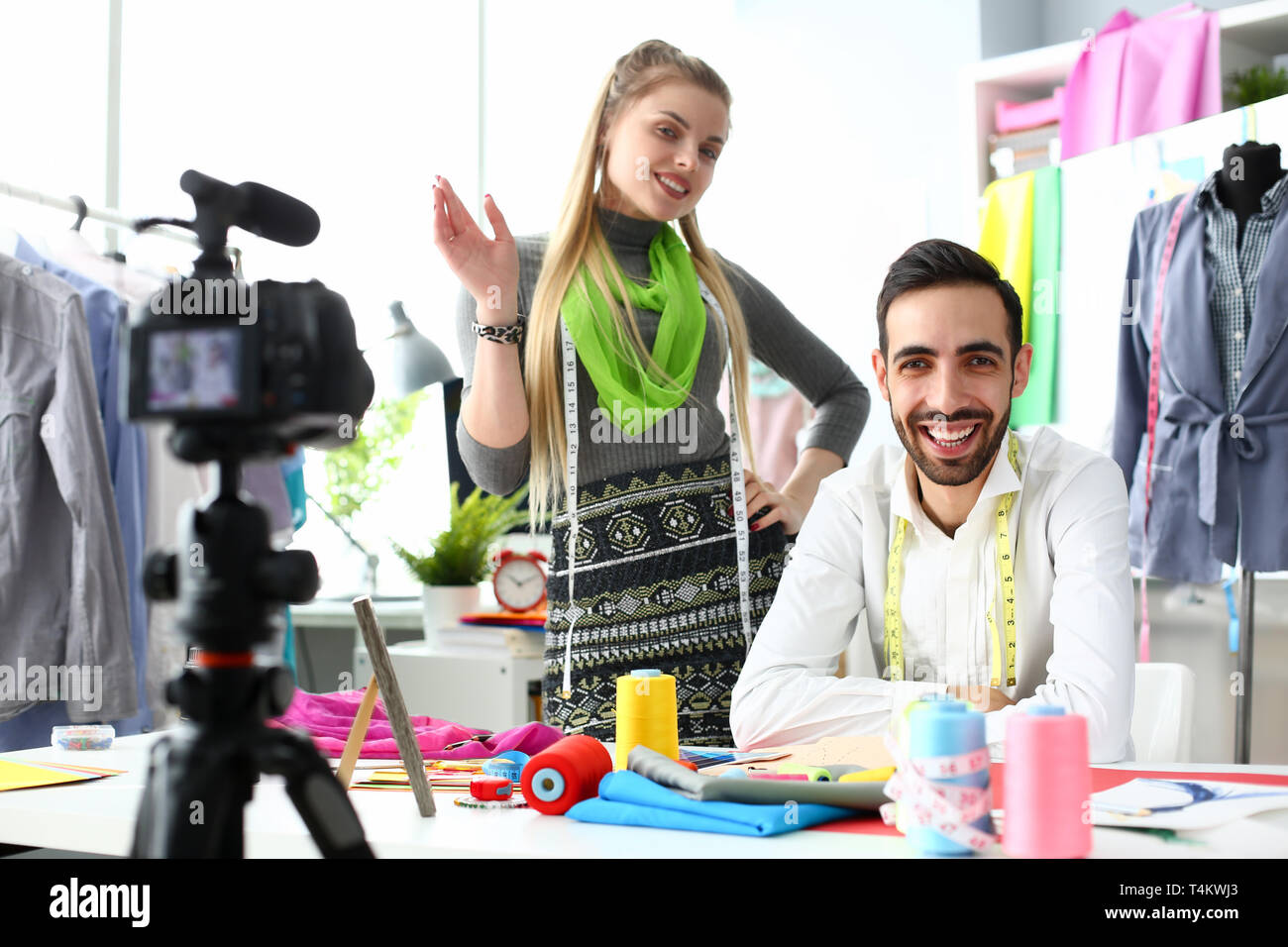 Couple man and woman wave their hands Stock Photo - Alamy