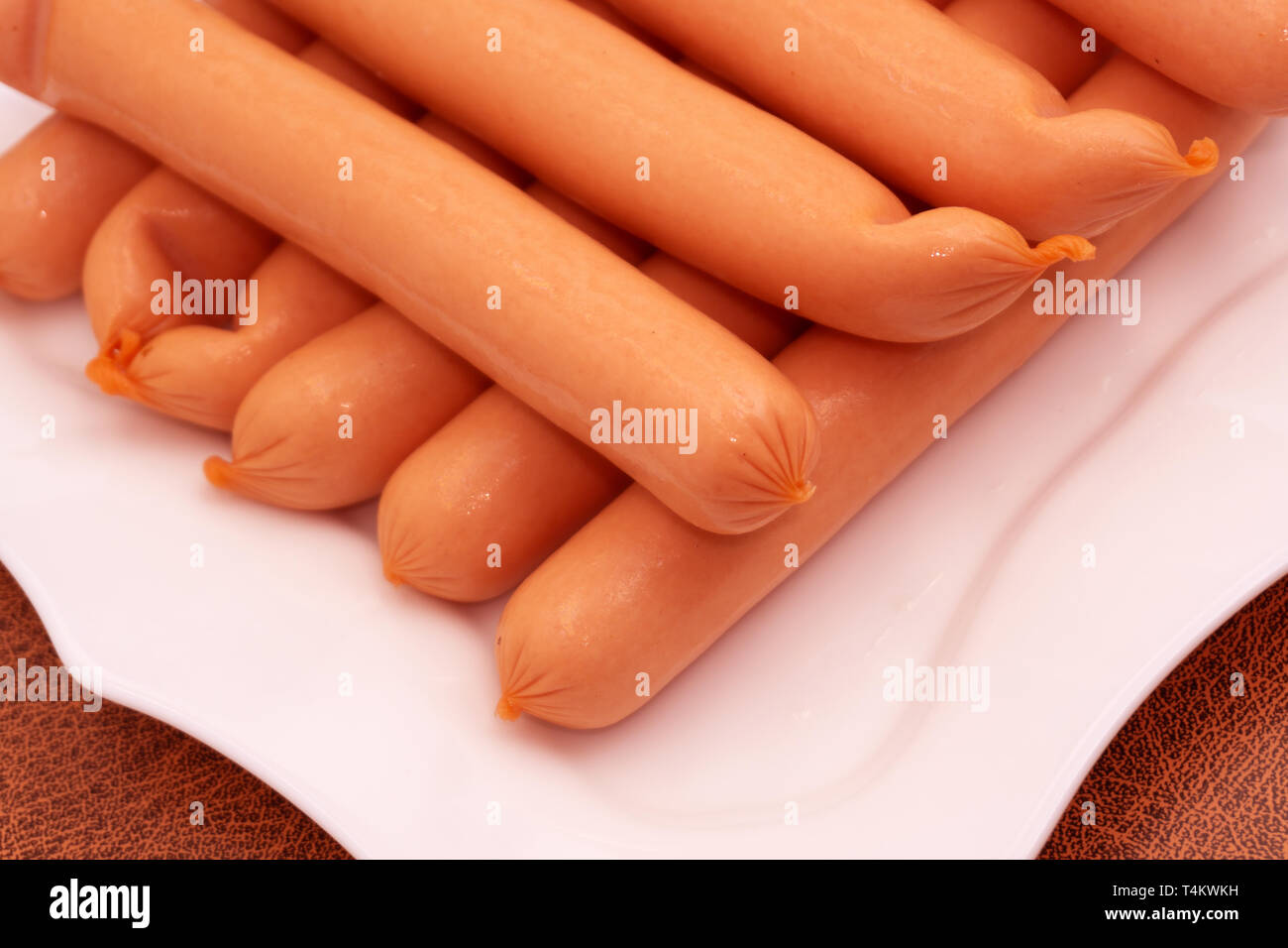 raw sausages isolated on white background. Top view Stock Photo - Alamy