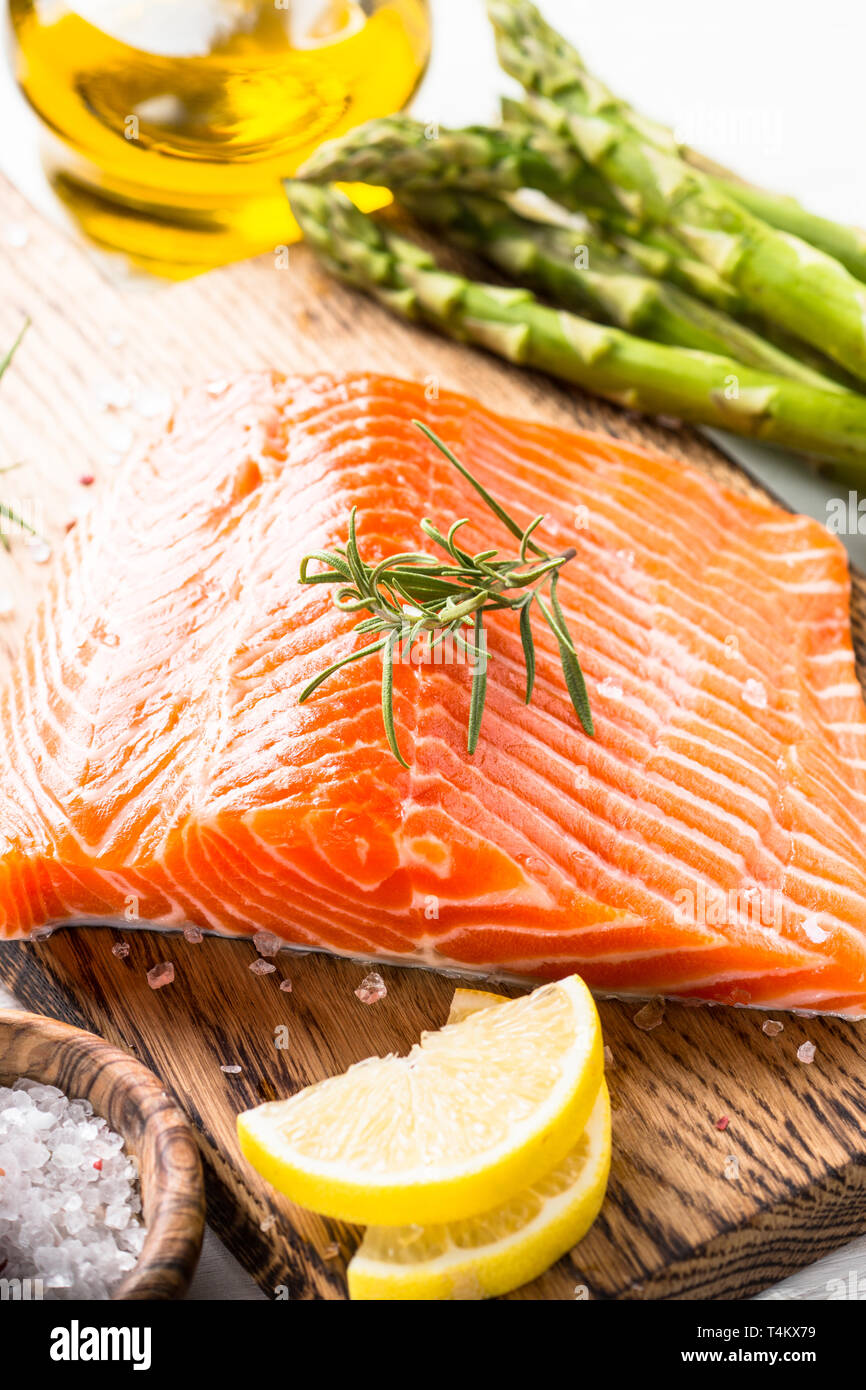 Fresh fish salmon with lemon sea salt and rosemary on white Stock Photo ...