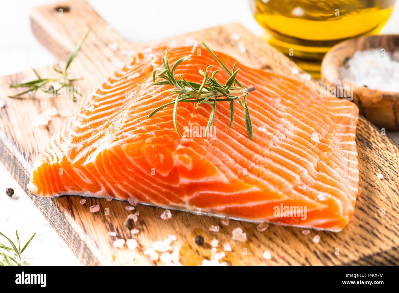Fresh fish salmon with lemon sea salt and rosemary on white Stock Photo ...
