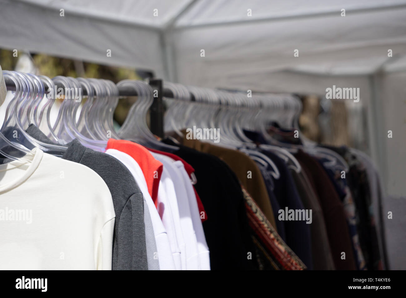 Winter clothes hanged on a clothes rack Stock Photo - Alamy