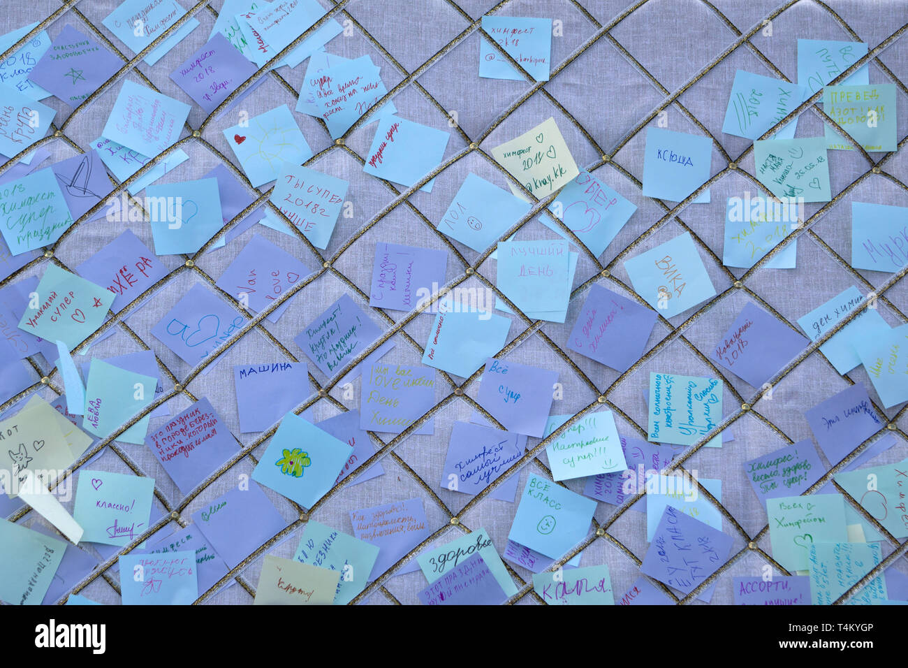 Business team look at the adhesive notes on glass wall in meeting room ...