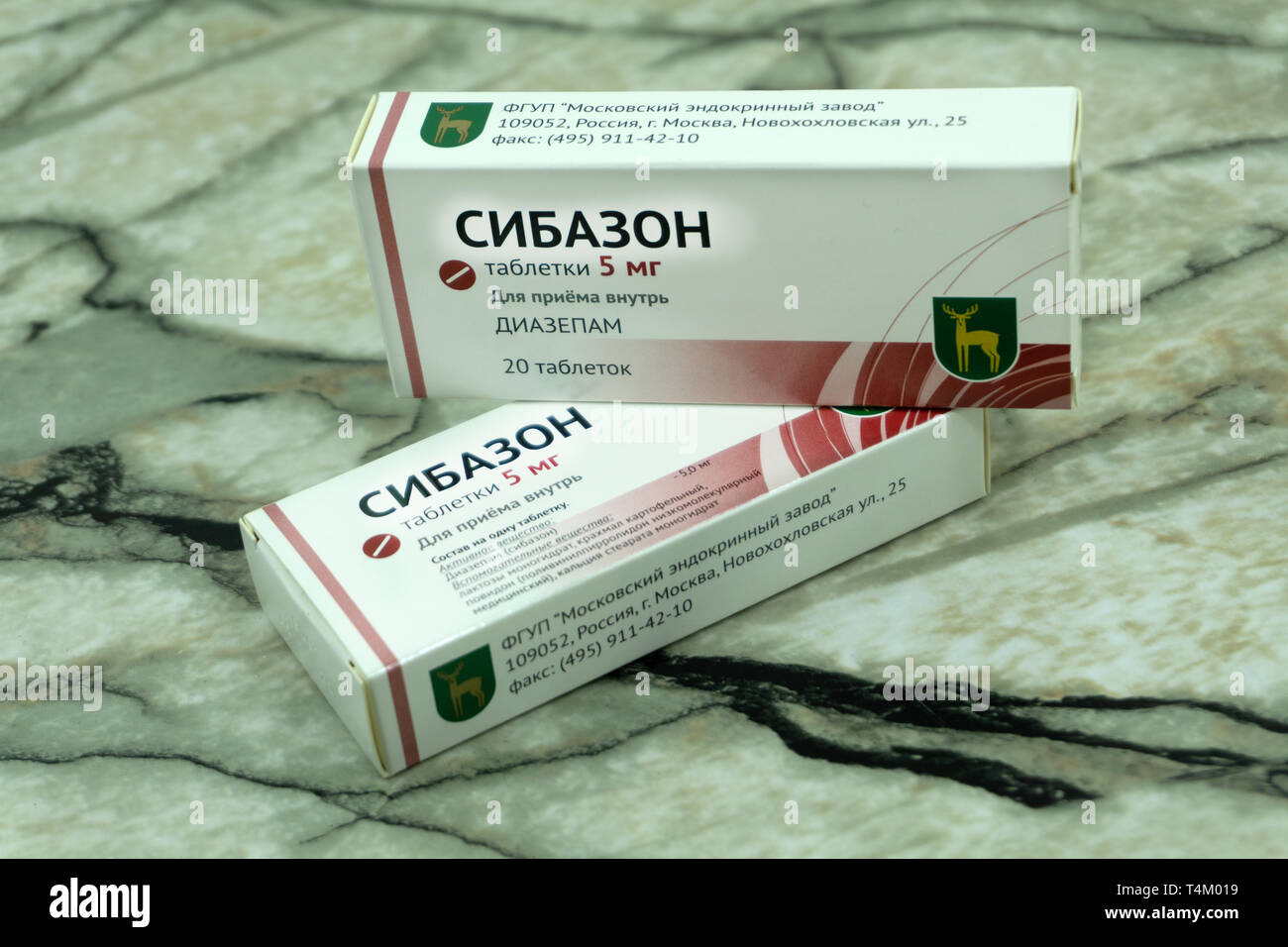 sibazon cropped image of a person taking pills from a blister pack at ...