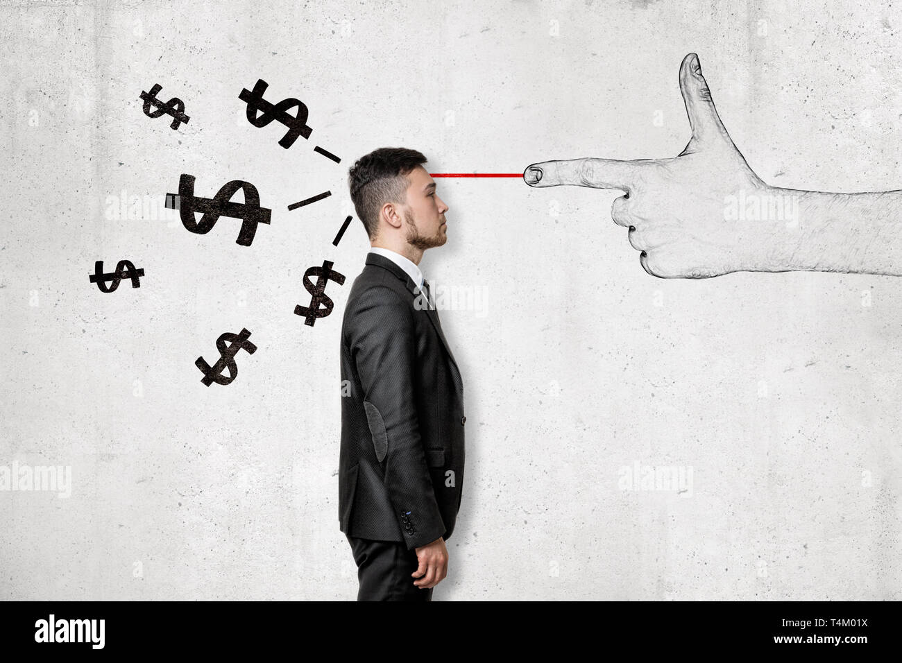 Young businessman side view with a hand shooting gesture, red bullet ...