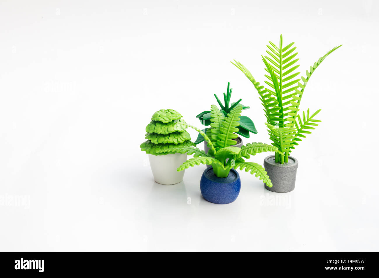 Detail of plastic toy plants in isolated white background Stock Photo ...