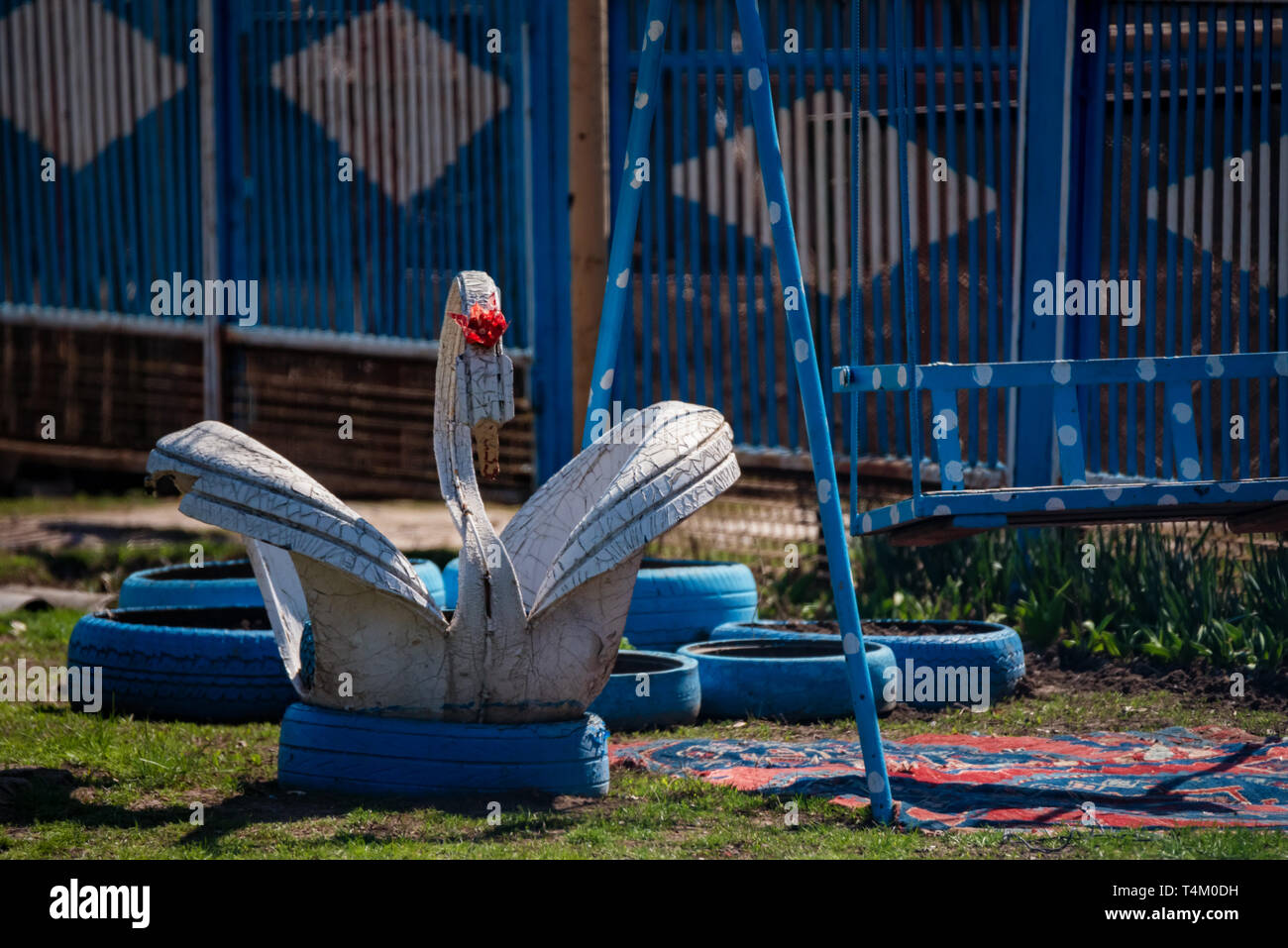 Garden decor. White swan made of tire Stock Photo - Alamy