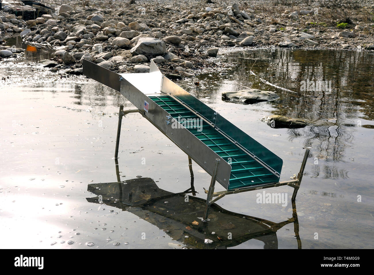 Sluice or washing ramp in situation in the water to search for gold in ...