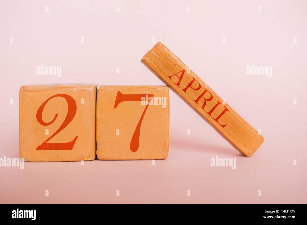 april 27th. Day 27 of month, handmade wood cube calendar on modern ...