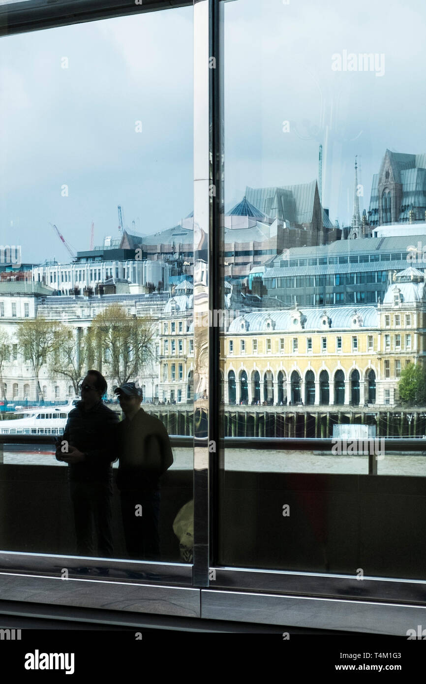 The distorted reflections of buildings on the Embankment seen in large ... The distorted reflections of buildings on the Embankment seen in large ...