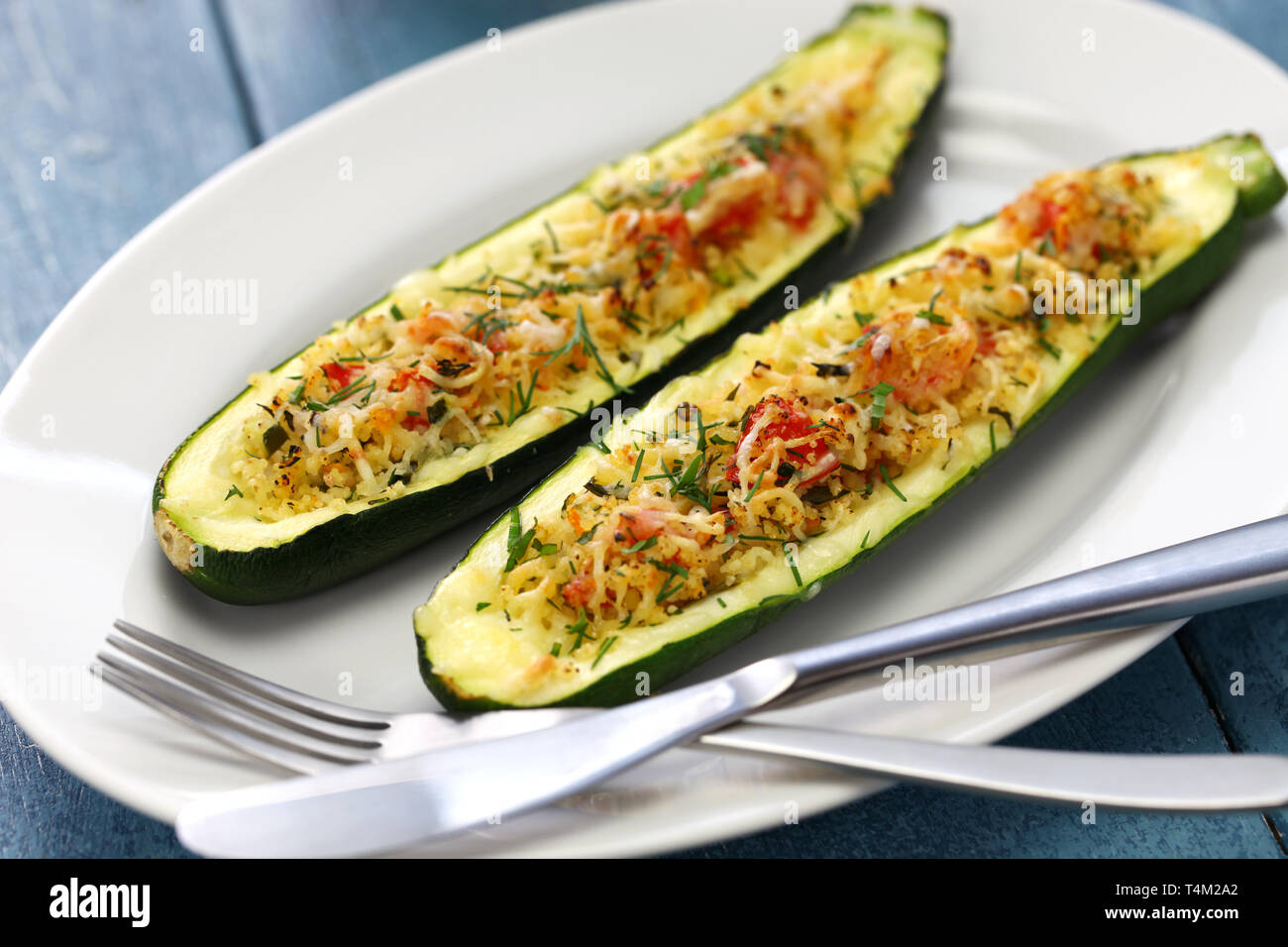 baked vegetarian zucchini boats, courgette farcie Stock Photo - Alamy