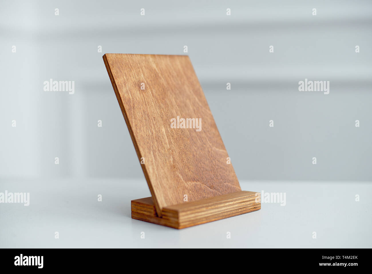 Vintage rectangular shaped wooden number buttons on a white wooden ...