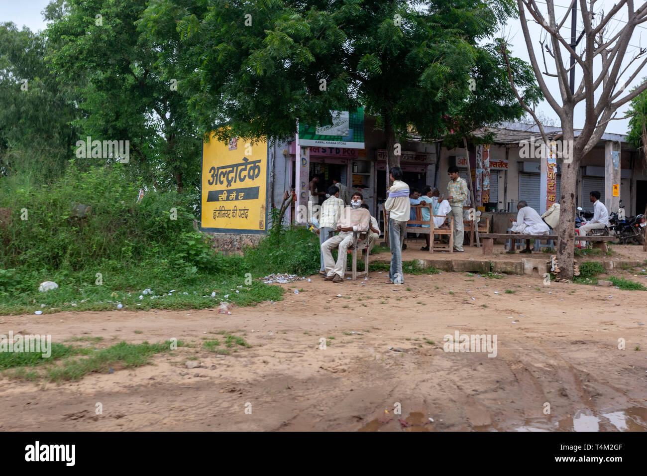 Man in a open rudimentary barber shop in a rural hi-res stock ...