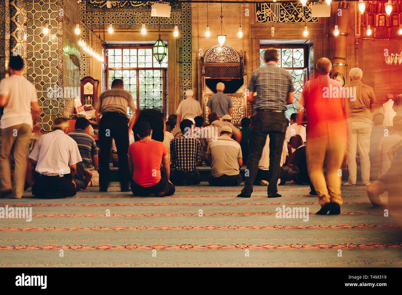People praying inside the New Mosque Stock Photo - Alamy