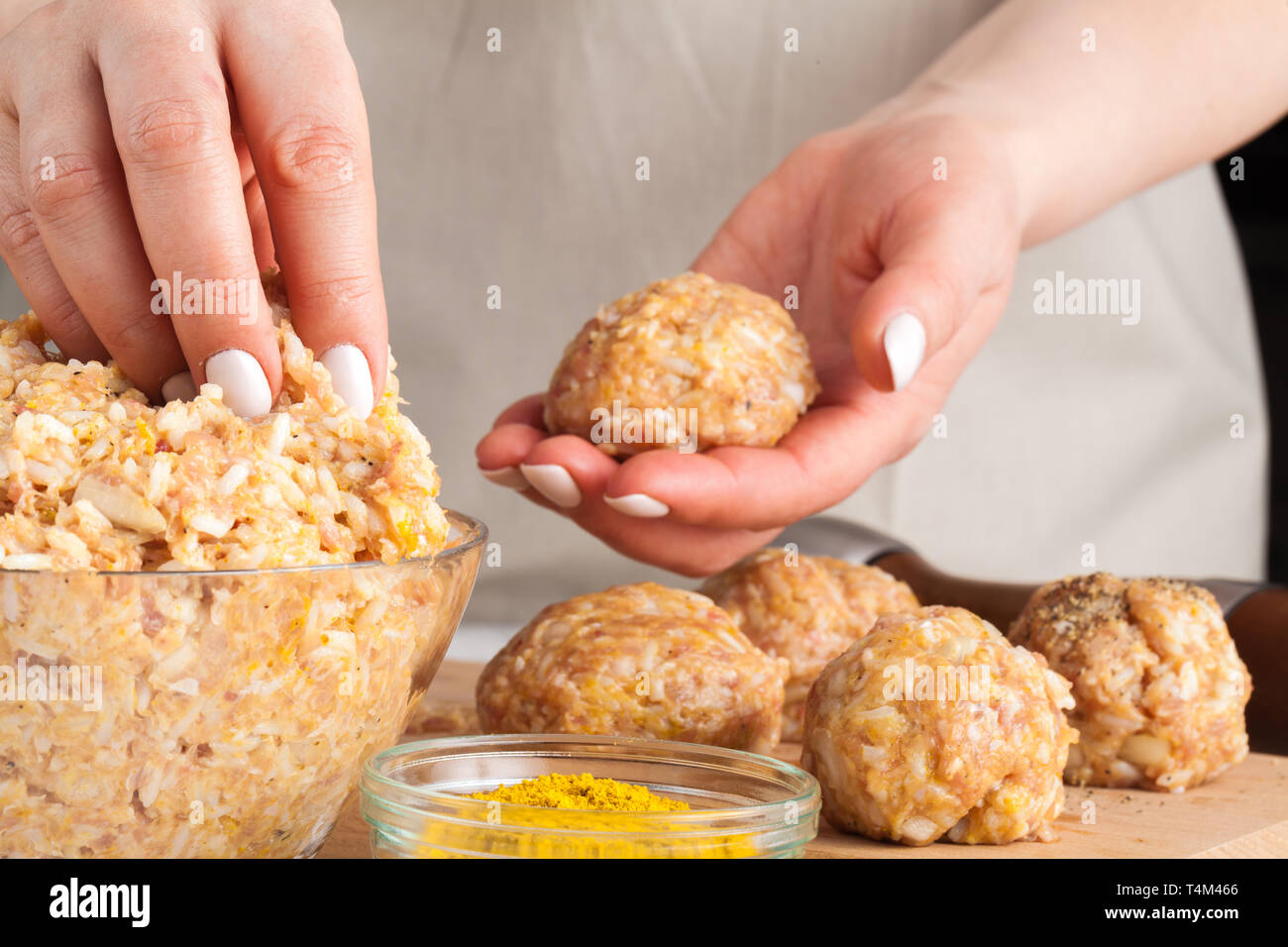 hands prepare meatballs from chicken meat Stock Photo - Alamy