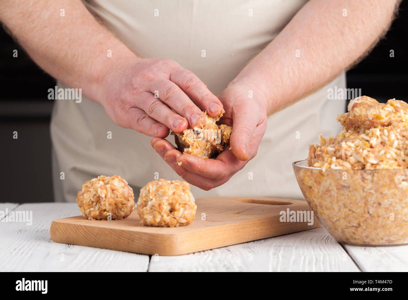 Raw diet chicken meatball cooking process Stock Photo - Alamy