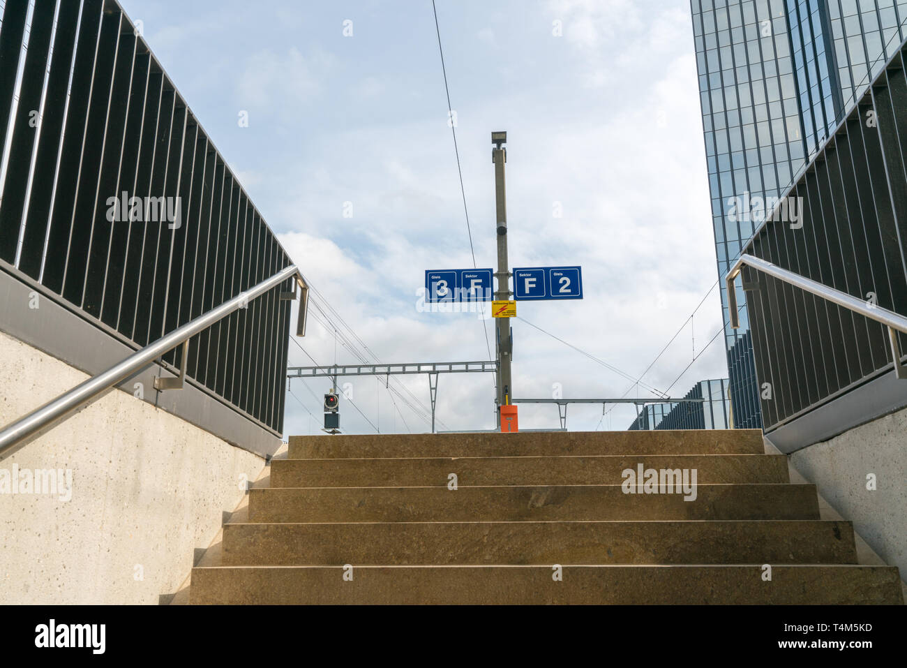 horizontal view of the stairs leading up to the train platforms of the ...