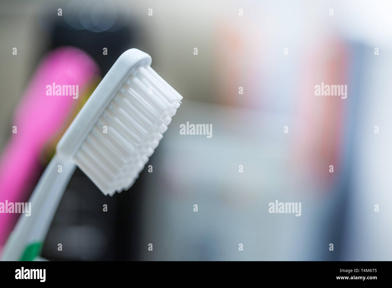 Colorful toothbrush in the bathroom, morning routine Stock Photo - Alamy
