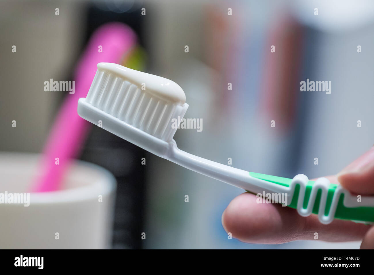 Colorful toothbrush in the bathroom, morning routine Stock Photo - Alamy